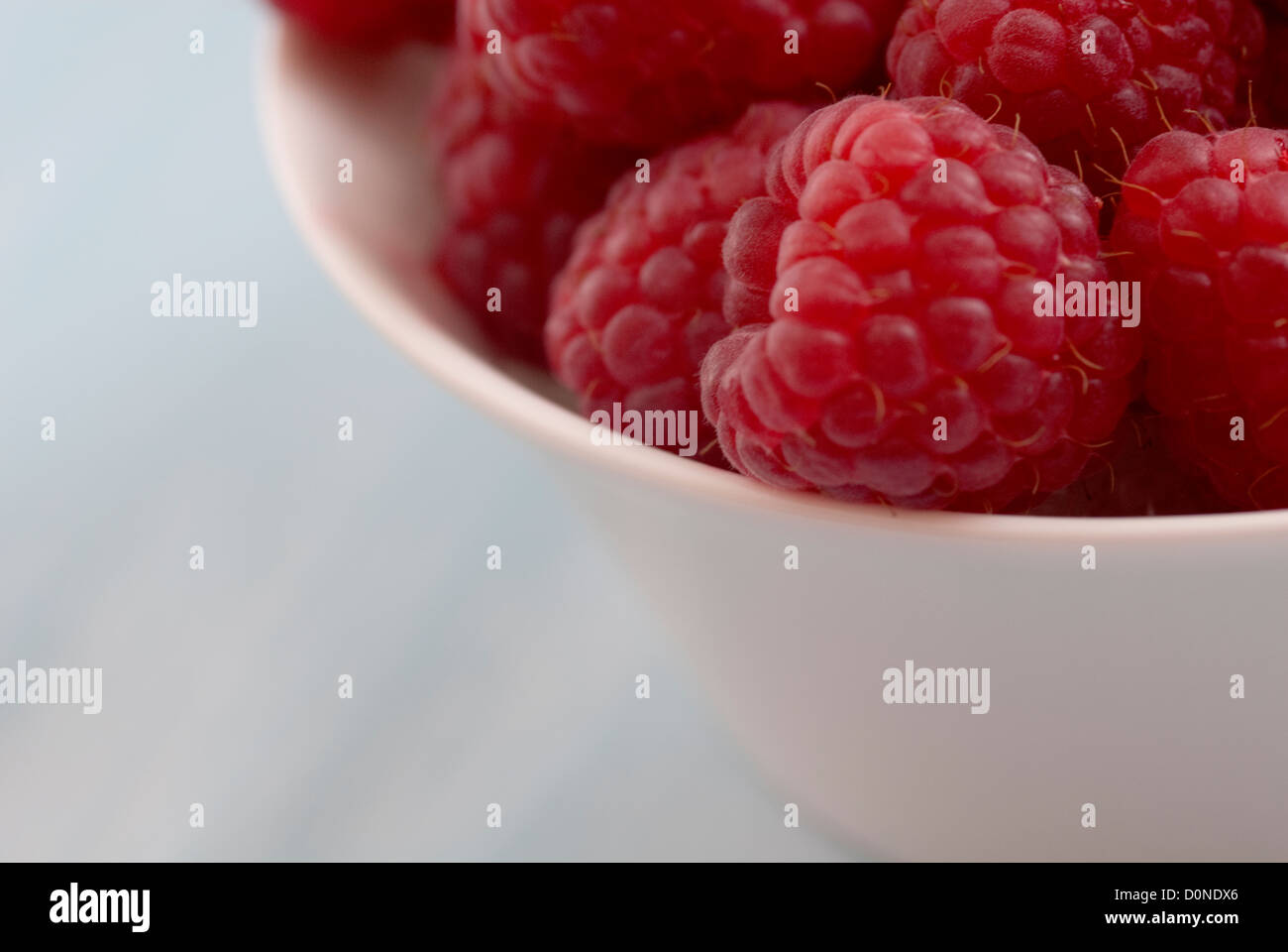 a bowl of red raspberries - still life Stock Photo - Alamy