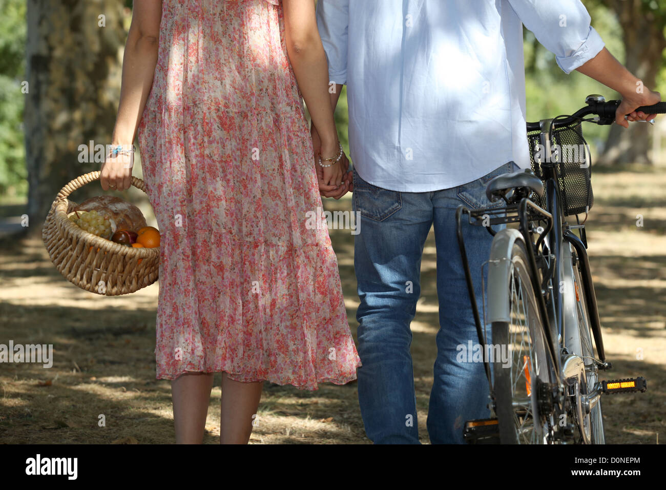 Couple on bike ride having picnic Stock Photo - Alamy