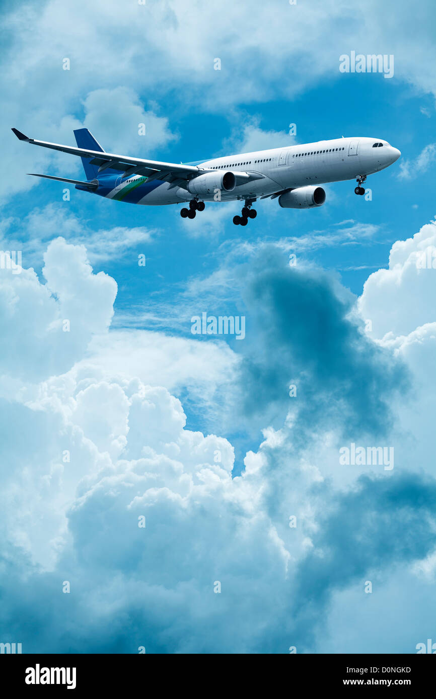 Jet plane above the clouds. Vertical composition Stock Photo - Alamy