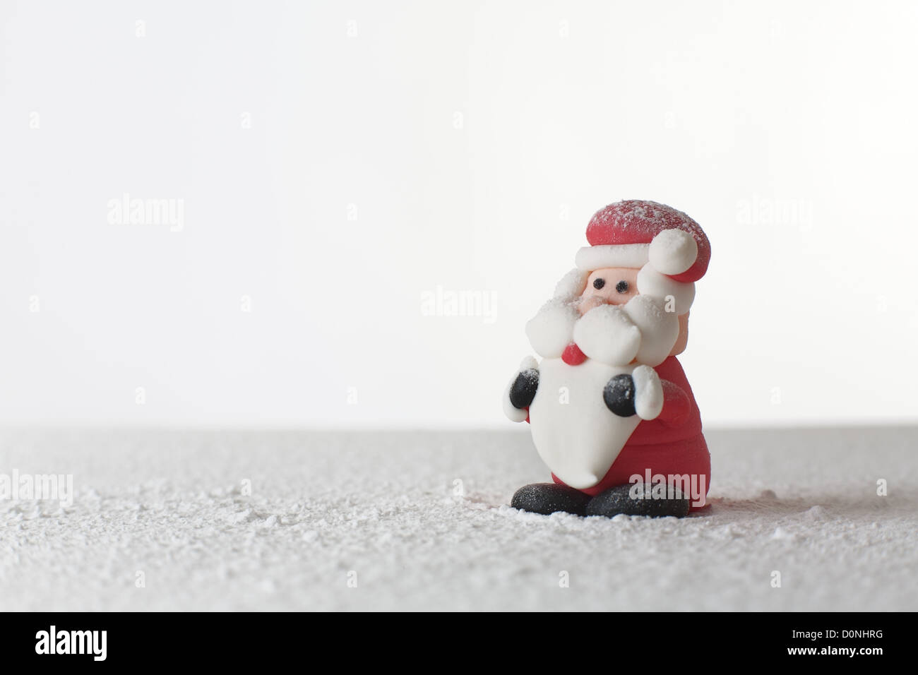 close up cake decoration of a iced santa claus figure stand on what ...
