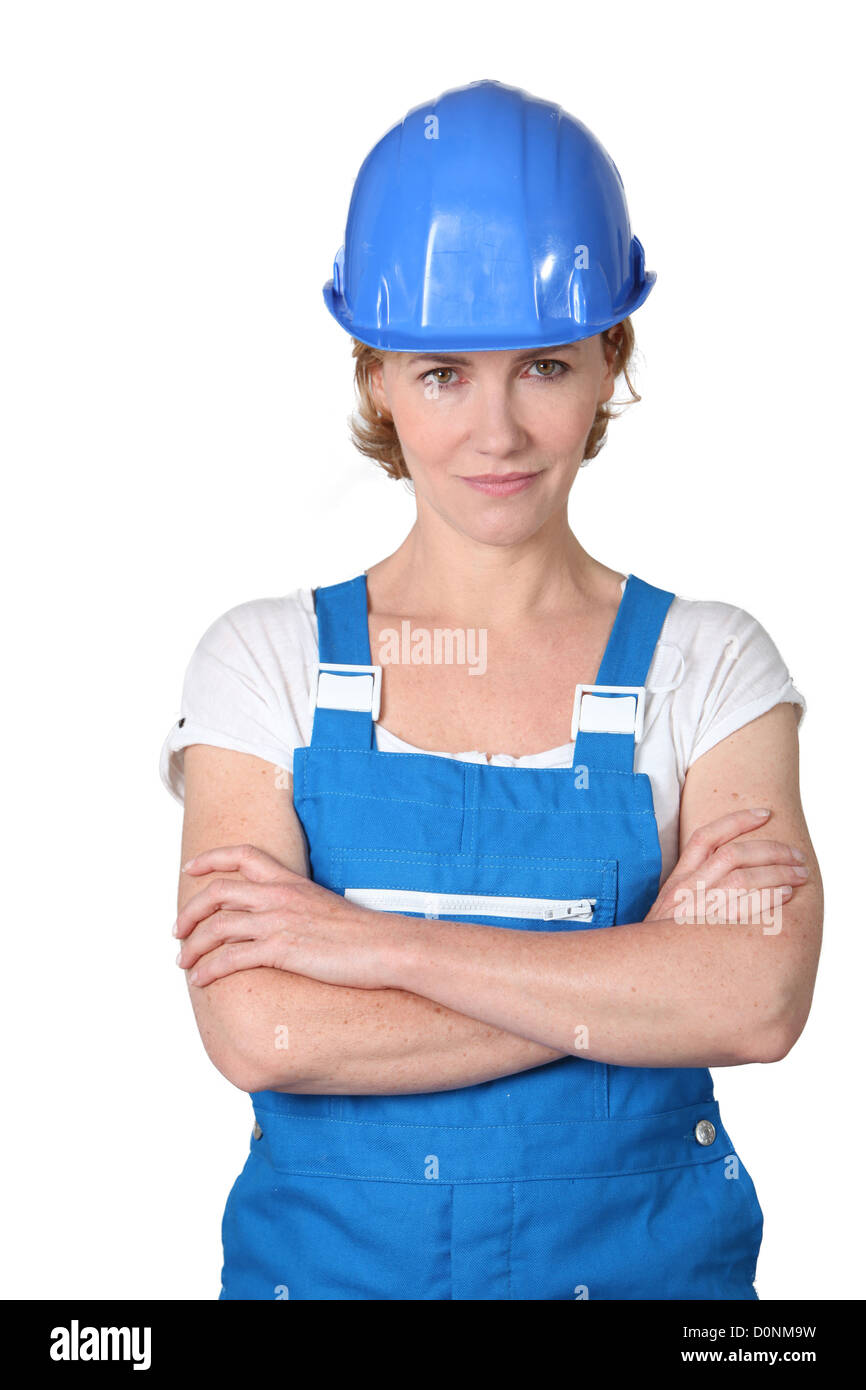 Woman wearing blue work overalls and hard hat Stock Photo - Alamy