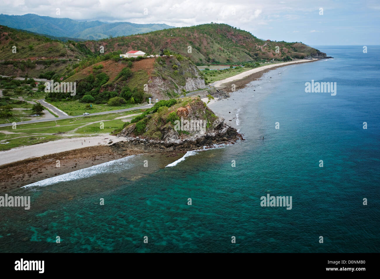 An aerial view coast west Dili East Timor. rock posts on road mark ...