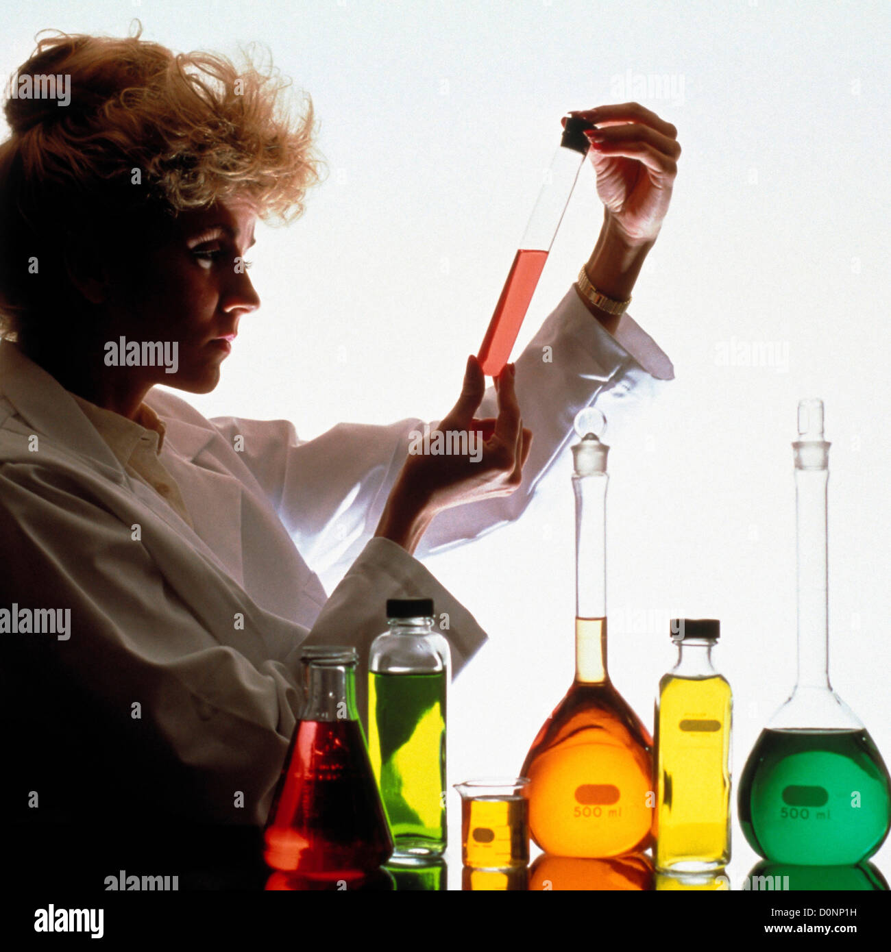 Chemist With Glassware Filled with Liquid Stock Photo - Alamy