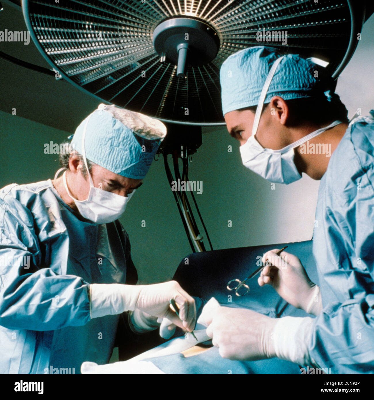 Two Surgeons in an Operating Room Stock Photo - Alamy
