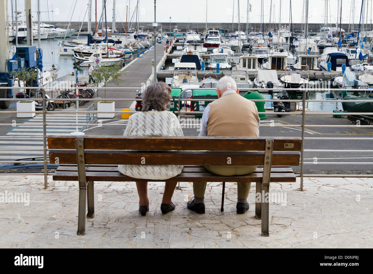 People sitting on a Bench in Chiavari in Liguria, Italy Stock Photo - Alamy