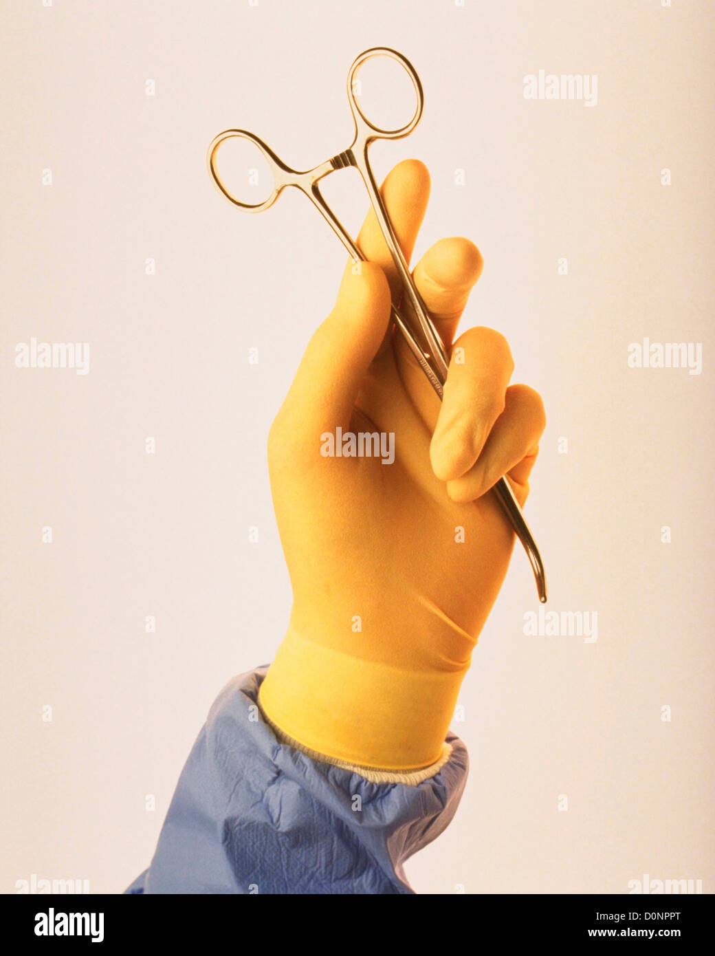 Hand with Surgical Glove Holding Surgical Clamp Stock Photo - Alamy