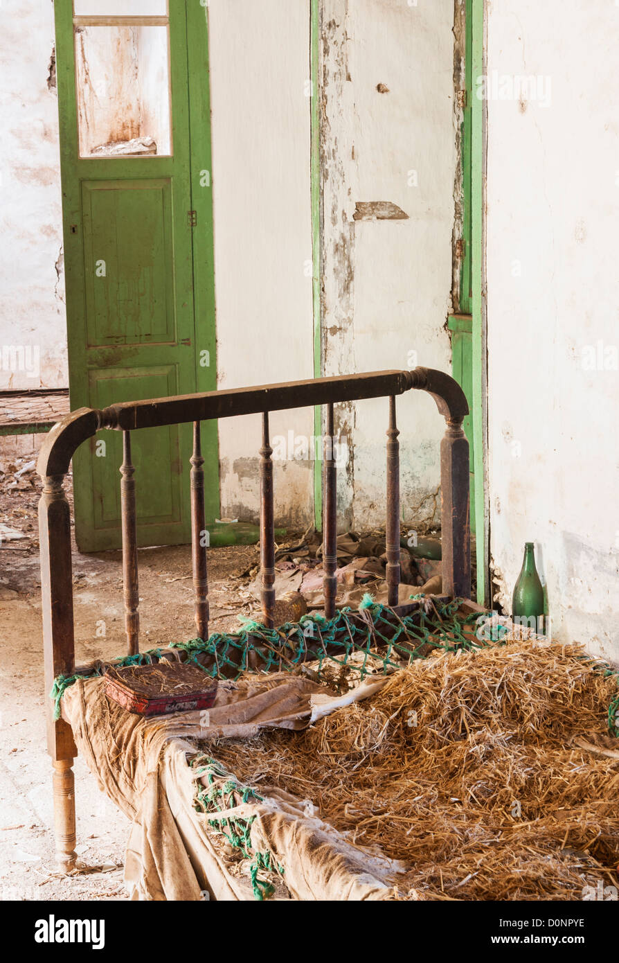 Old bed in derelict building Stock Photo - Alamy