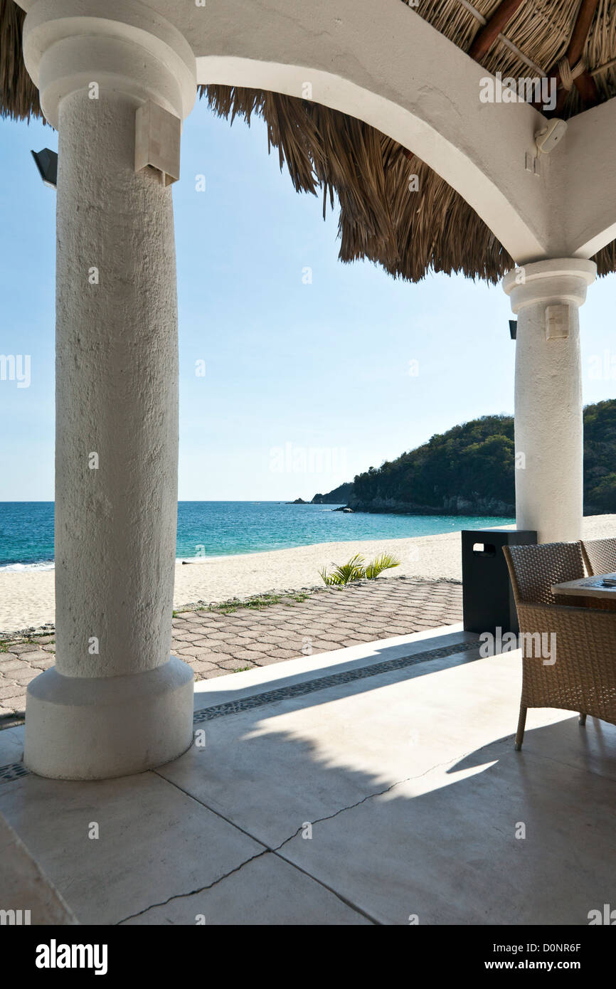 elegant beach pavilion palapa overlooking white sand beach & blue ocean ...