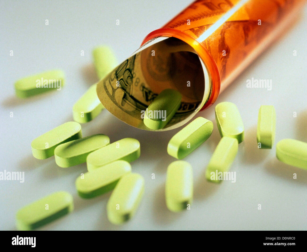 Pill Bottle with Pills and a Fifty Dollar Bill Stock Photo - Alamy