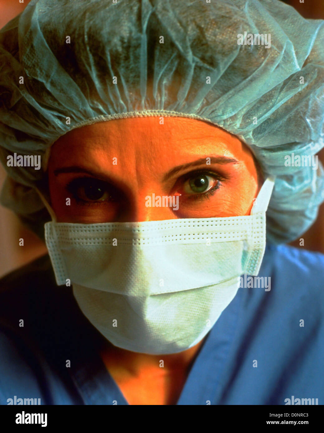 Portrait of a Female Nurse Wearing Surgical Cap and Mask Stock Photo ...