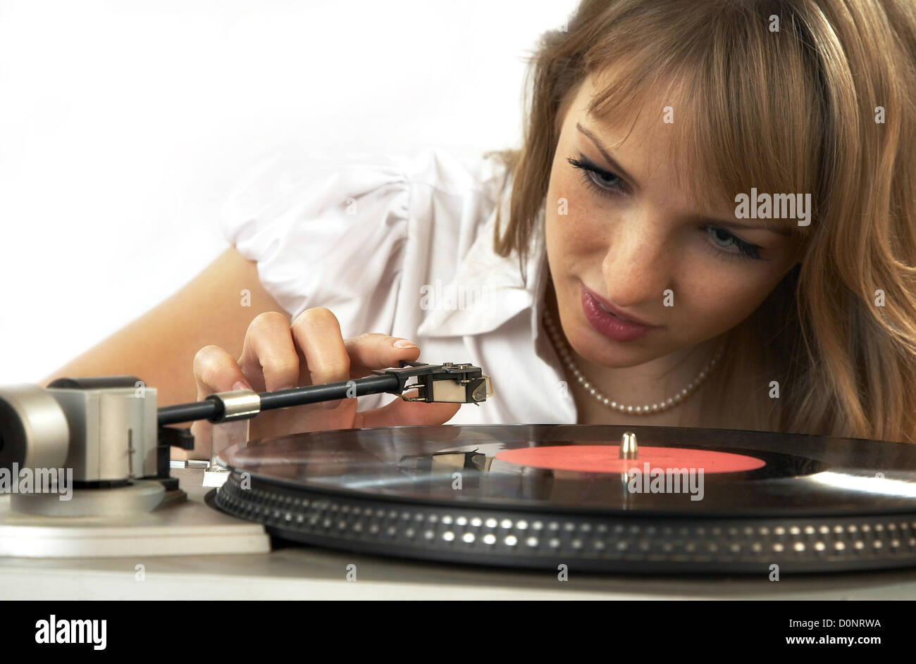 The girl listens to a vinylic disk Stock Photo - Alamy