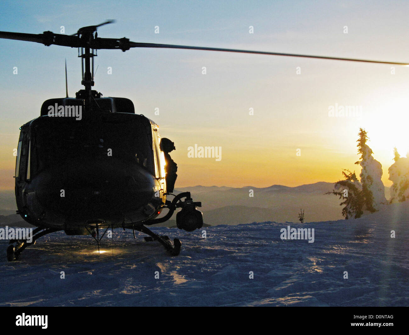 A UH-1N Huey sits on top Calispell Peak in northern survival training ...