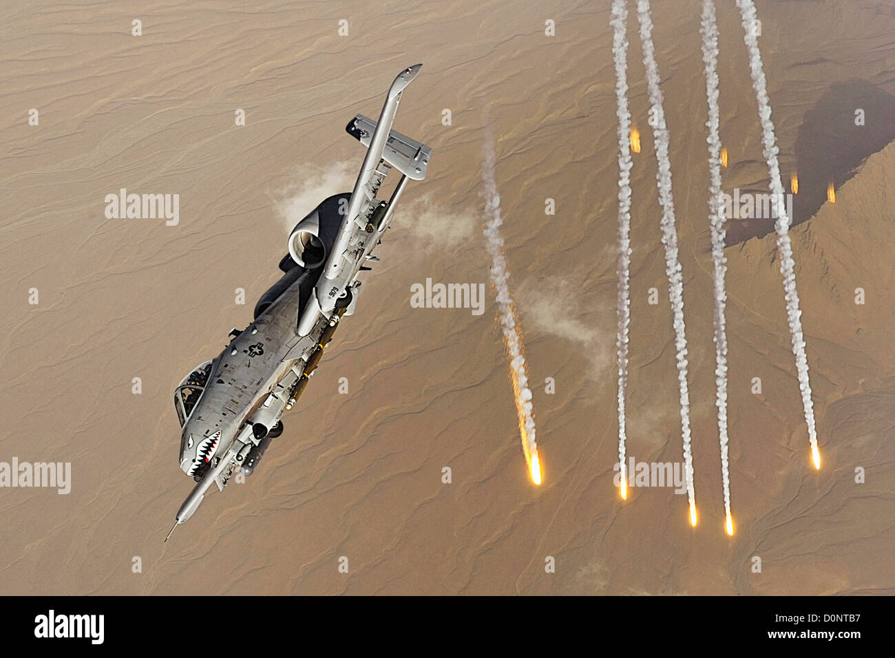 An A-10 Thunderbolt II deploys flairs over Afghanistan. A-10s provide ...