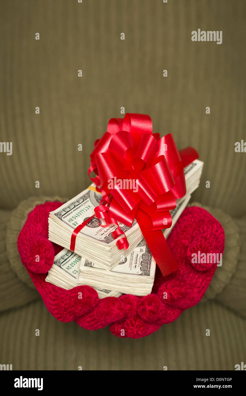 Woman Wearing Red Mittens and Green Sweater Holding Stacks of Hundreds ...