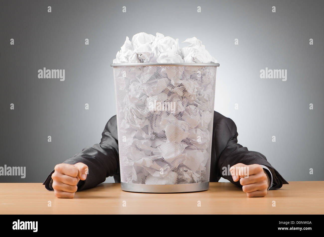 Man with lots of wasted paper Stock Photo - Alamy