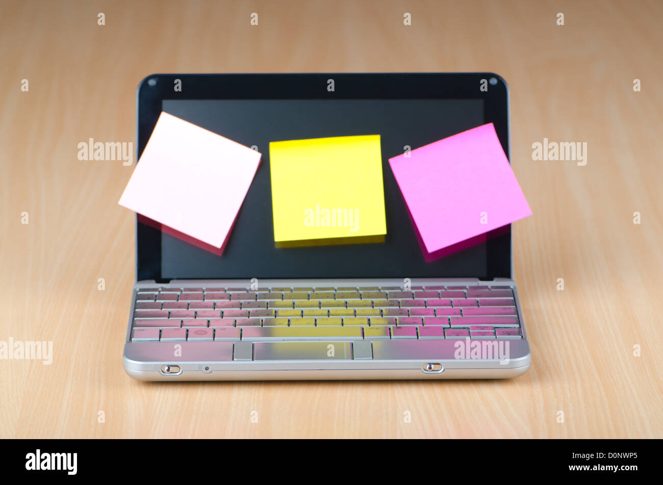 Netbook with reminder notes Stock Photo - Alamy