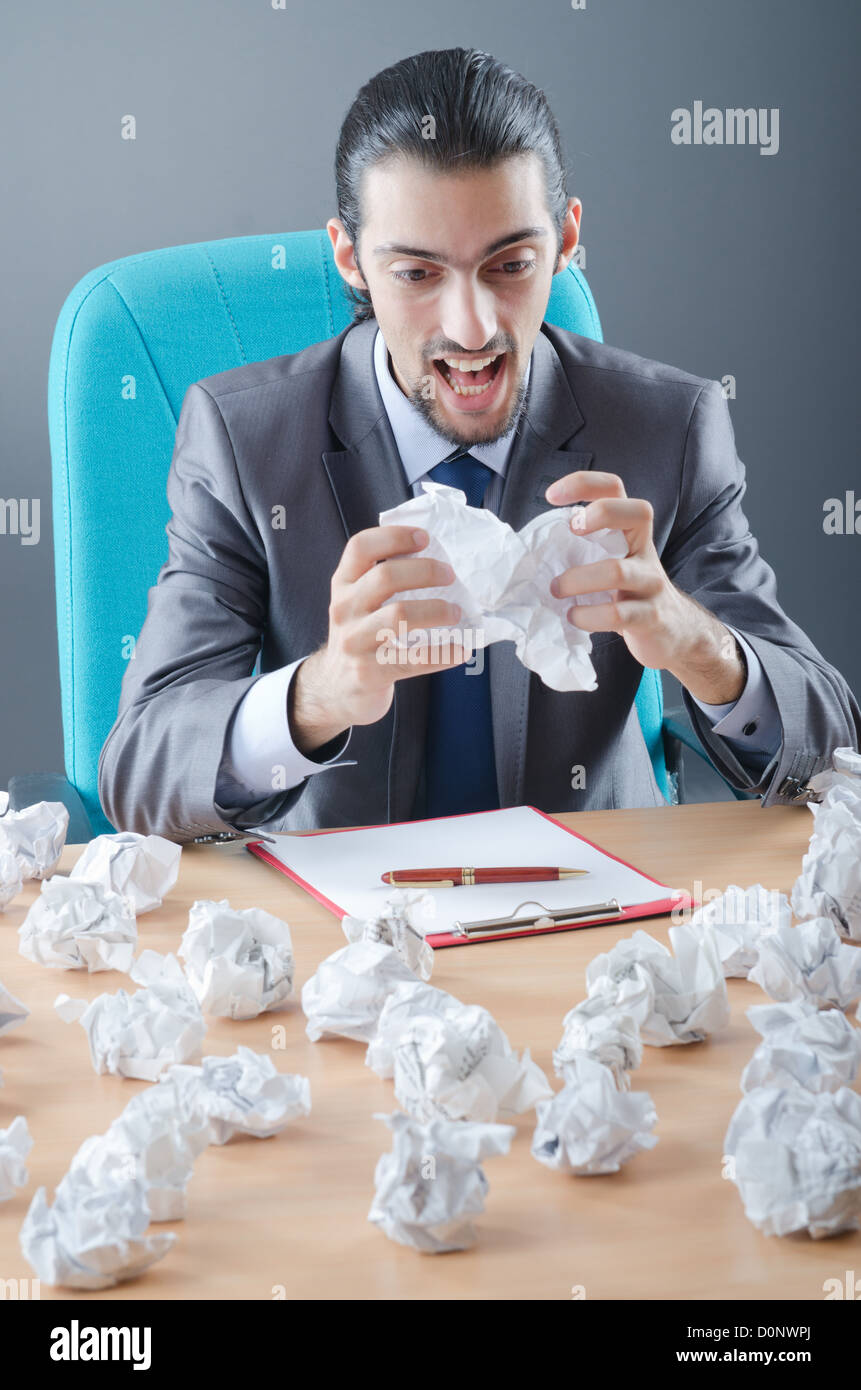 Businessman throwing paper away Stock Photo - Alamy