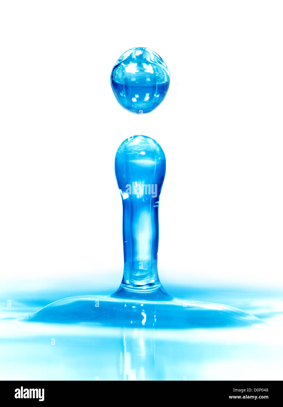 Falling drop of blue water Stock Photo - Alamy