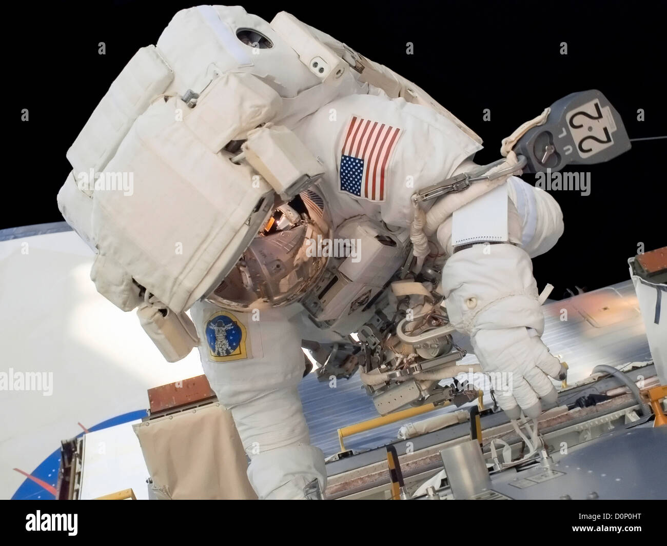 Astronaut Working on International Space Station Stock Photo - Alamy