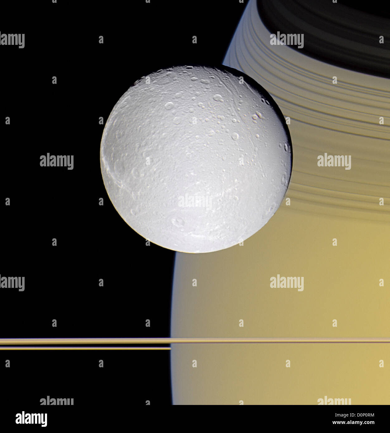 Dione and the Rings of Saturn Stock Photo - Alamy