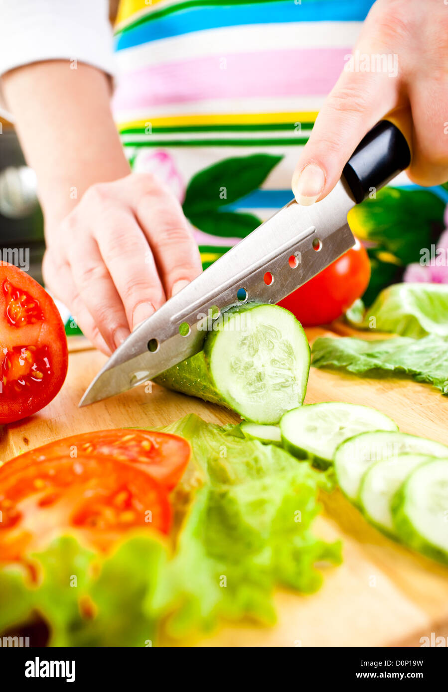 Woman's hands cutting vegetables Stock Photo - Alamy