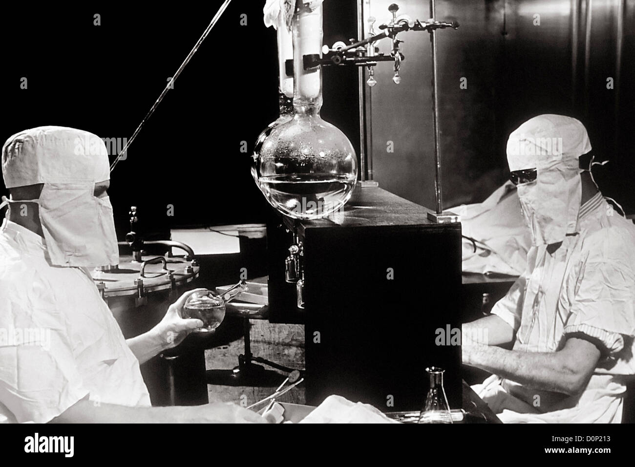 Researchers in a laboratory wear full-face coverings while handling ...