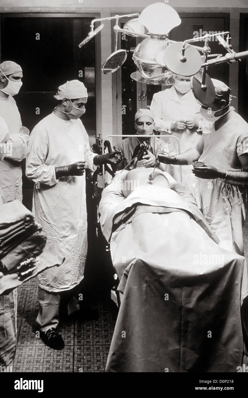 Doctors in an operating room ready to perform cancer surgery on a ...