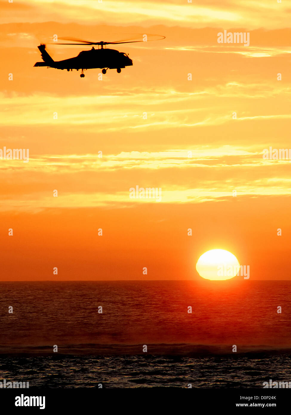 Seahawk Helicopter Over Pacific Ocean at Sunset Stock Photo - Alamy