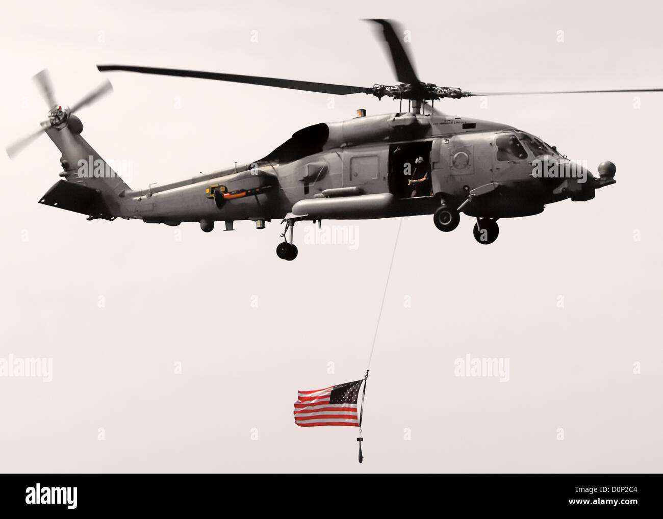 SH-60 Seahawk Flying American Flag Stock Photo - Alamy