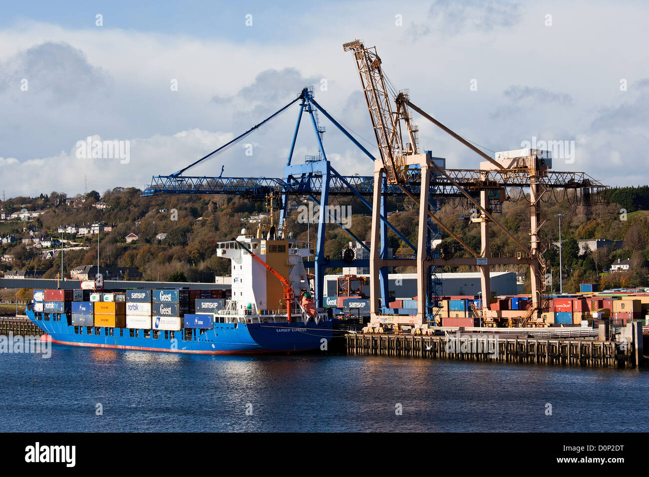 A container cargo ship being loaded in a port in Cork (Ireland Stock ...