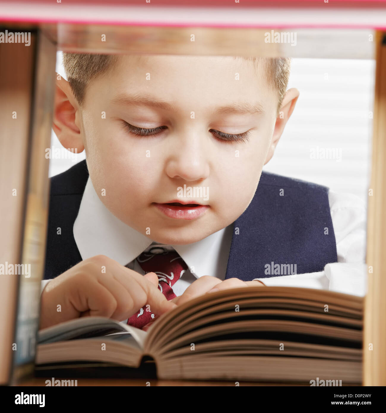 Schoolboy reading book Stock Photo - Alamy Schoolboy reading book Stock Photo - Alamy