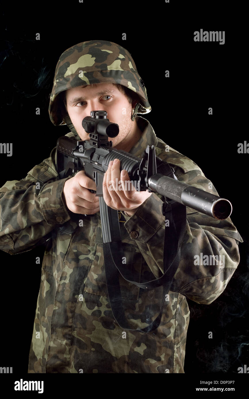 Alerted soldier keeping a gun Stock Photo - Alamy