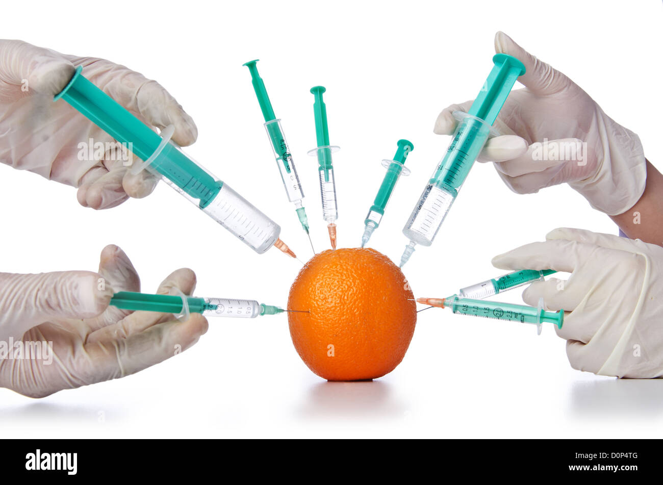 Science experiment with orange and syringe Stock Photo - Alamy