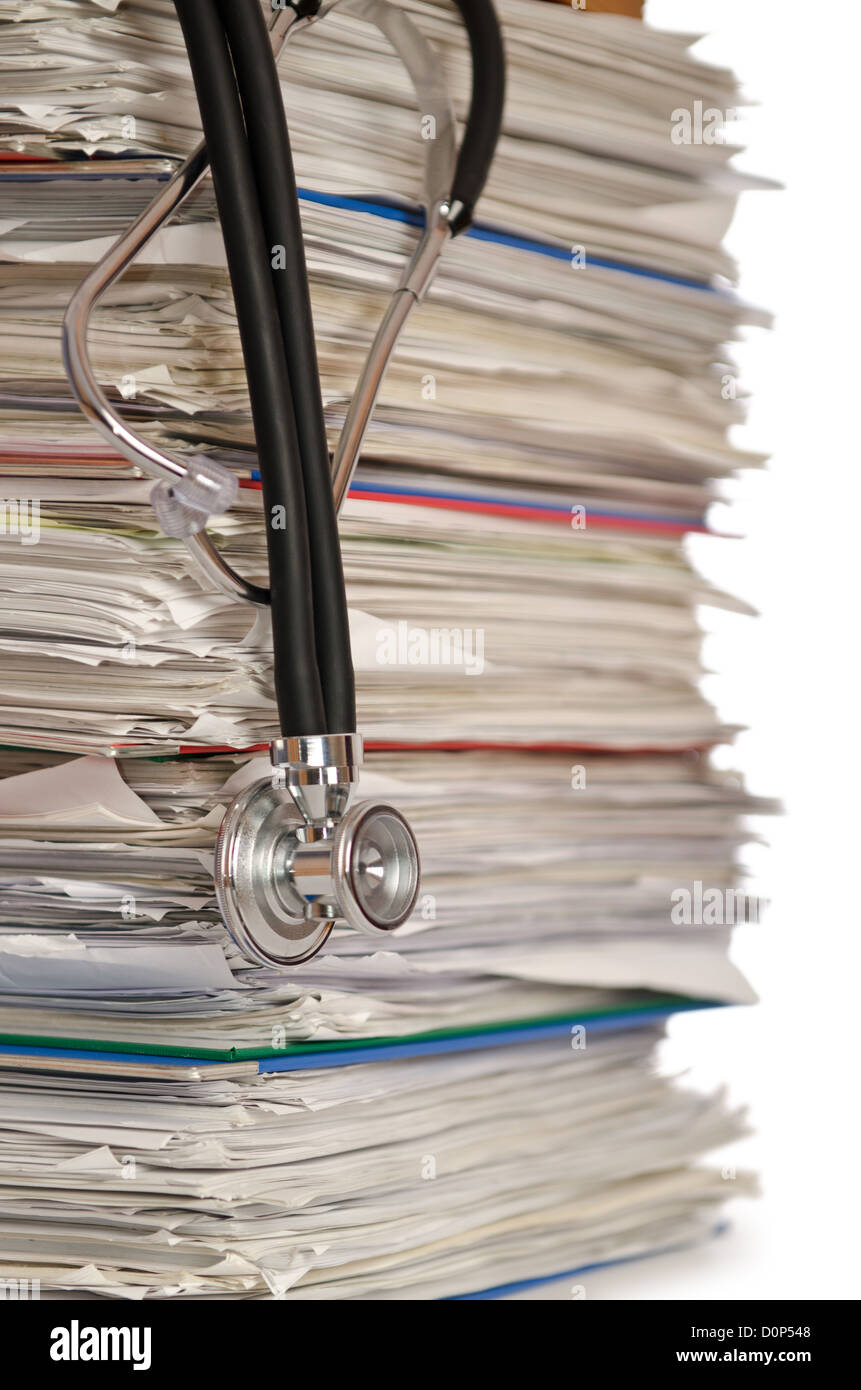 Stack of papers with stethoscope Stock Photo - Alamy