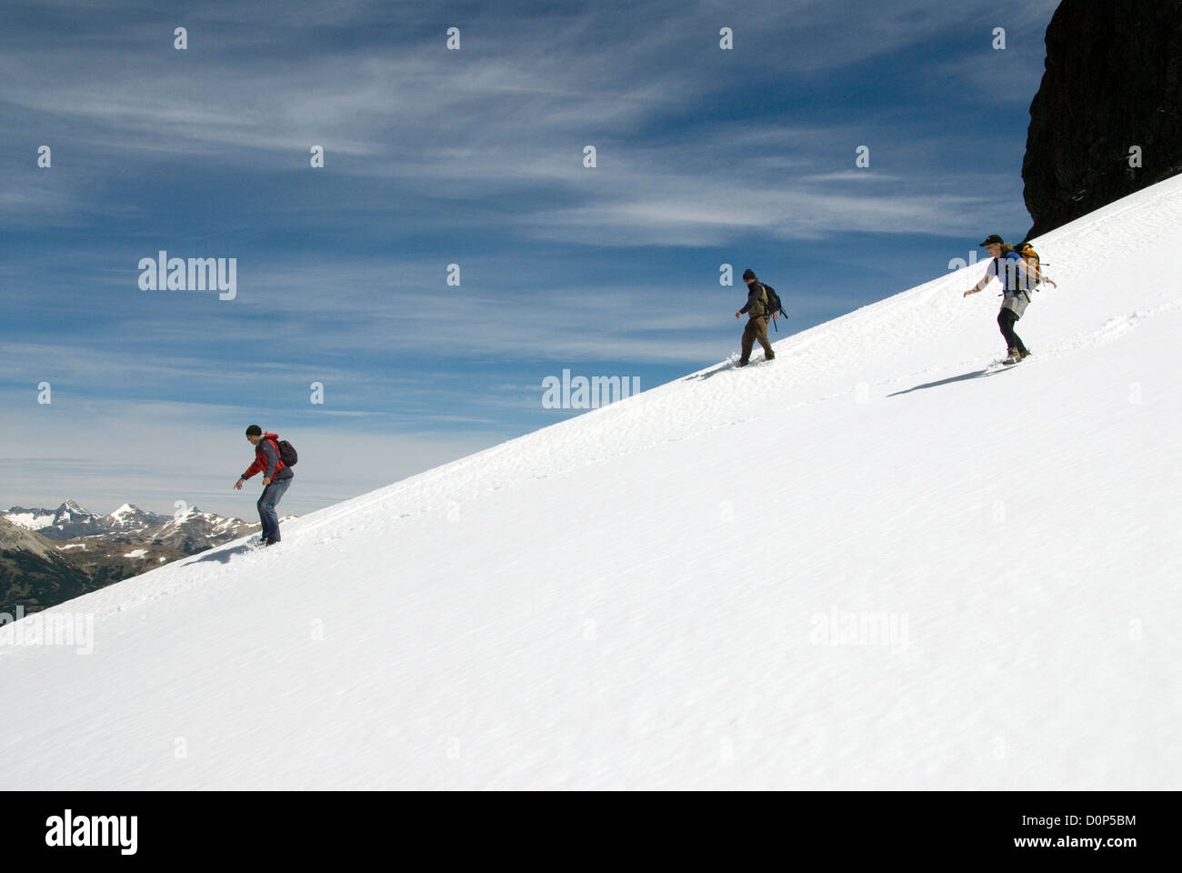 Hikers descending snowfield on Cerro Teta, in the Andes Mountains of ...