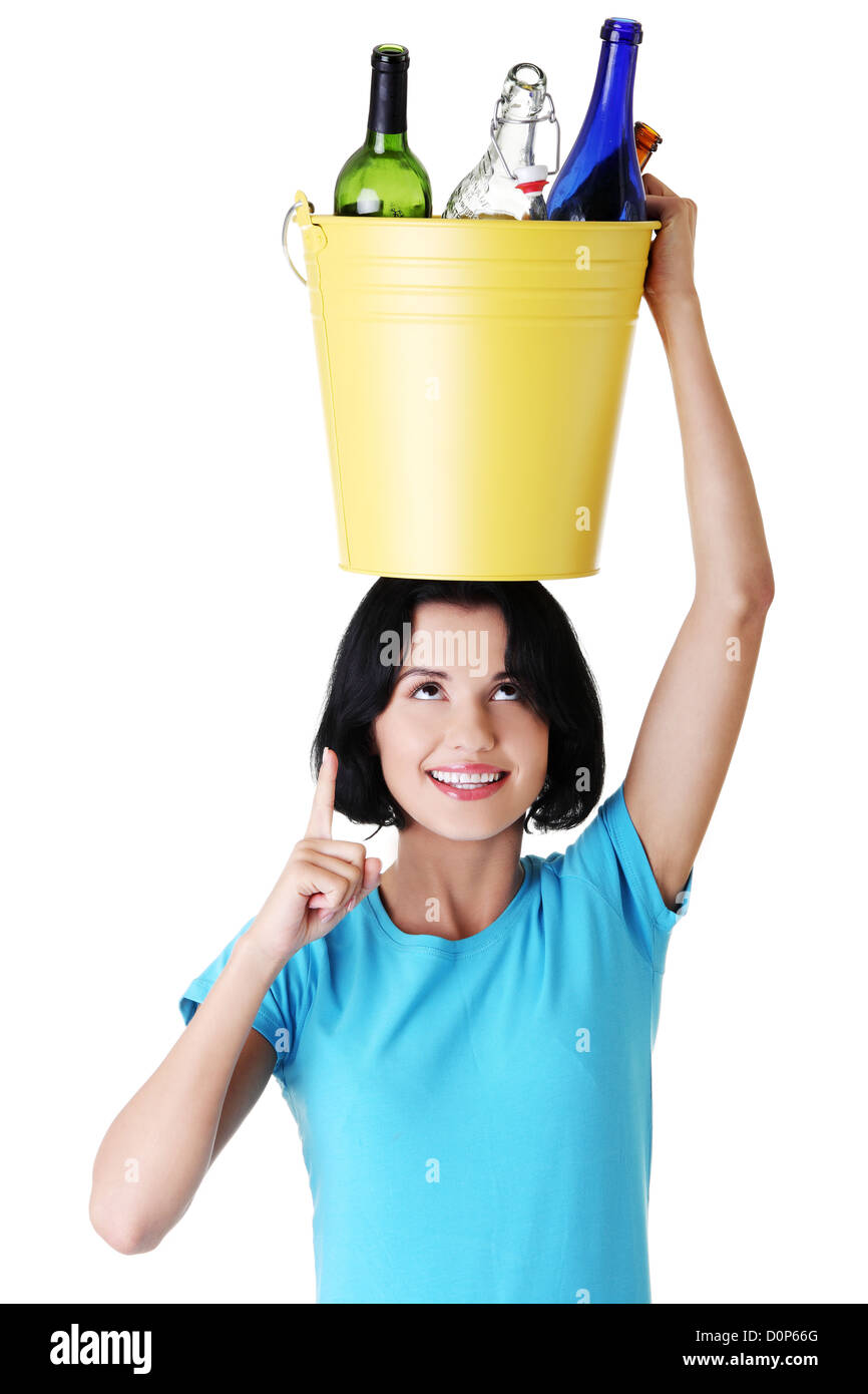 Beautiful young woman holding recycling bin isolated on white ...