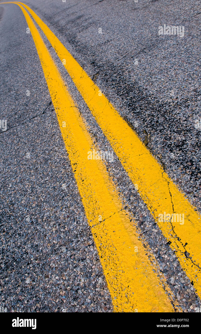 yellow dividing lines on the highway Stock Photo - Alamy