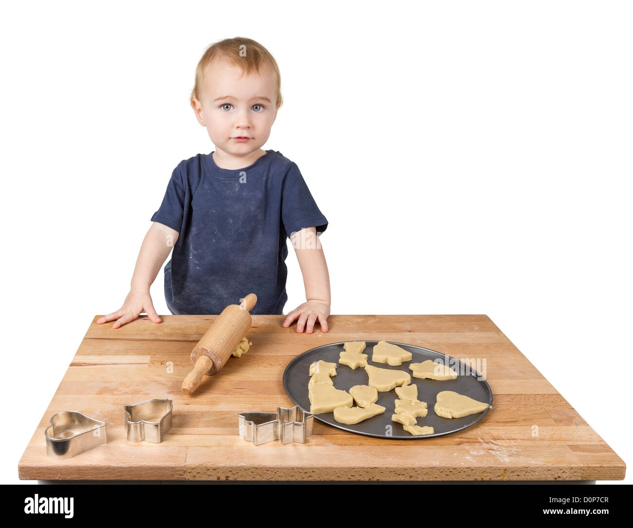 young child making cookies on small wooden desk Stock Photo - Alamy