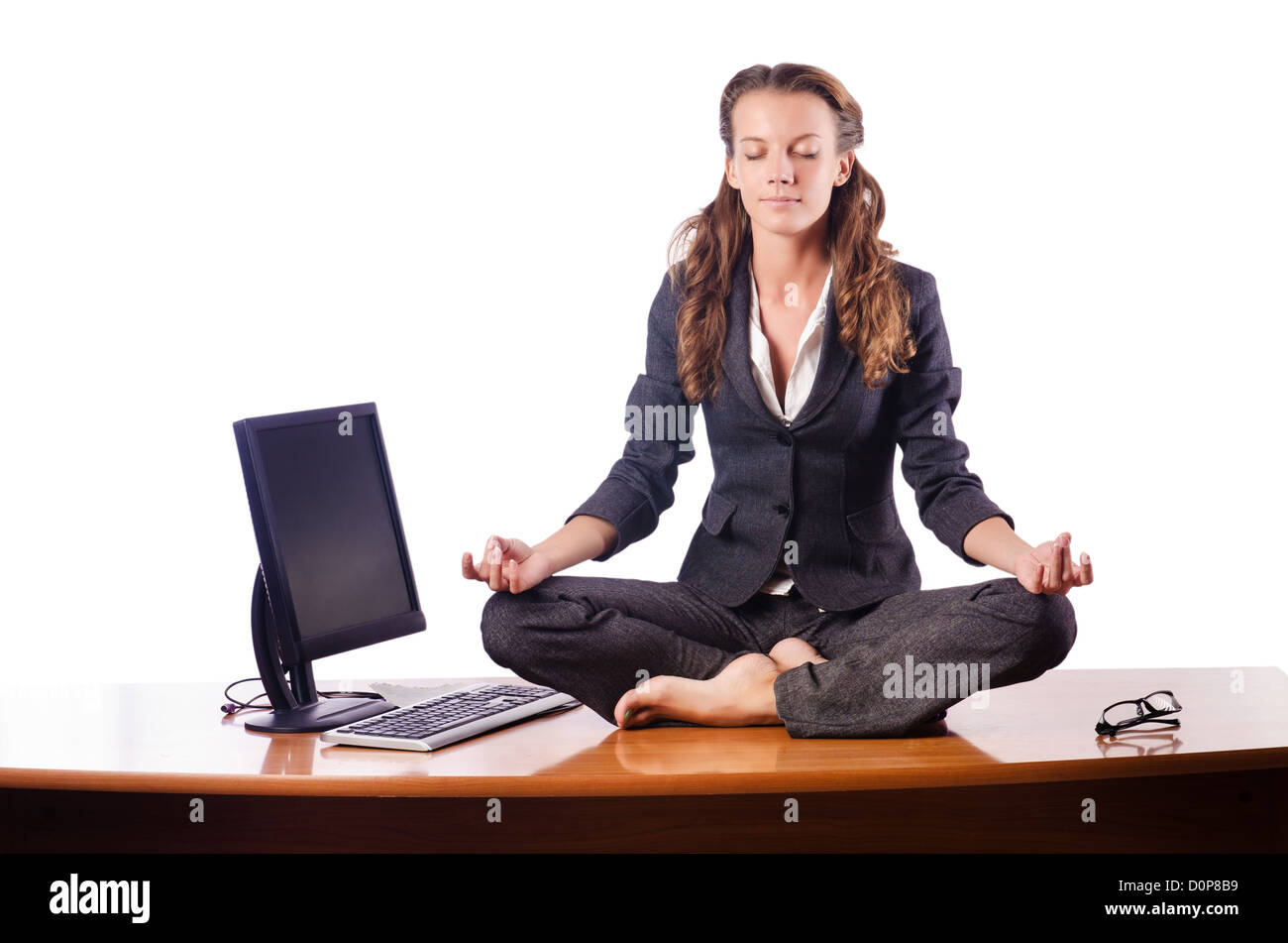 Woman meditating on the desk Stock Photo - Alamy