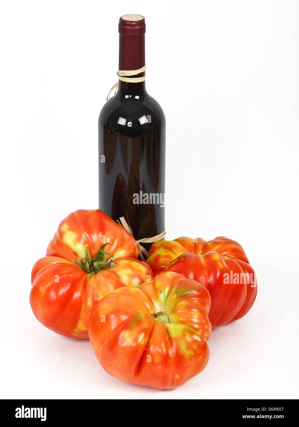 classic breed of tomato with bottle of red wine Stock Photo - Alamy