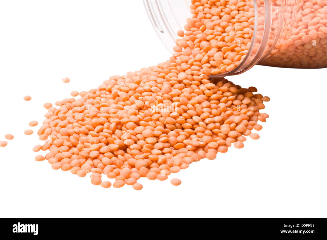 Close-up of red lentil spilling from a jar Stock Photo - Alamy