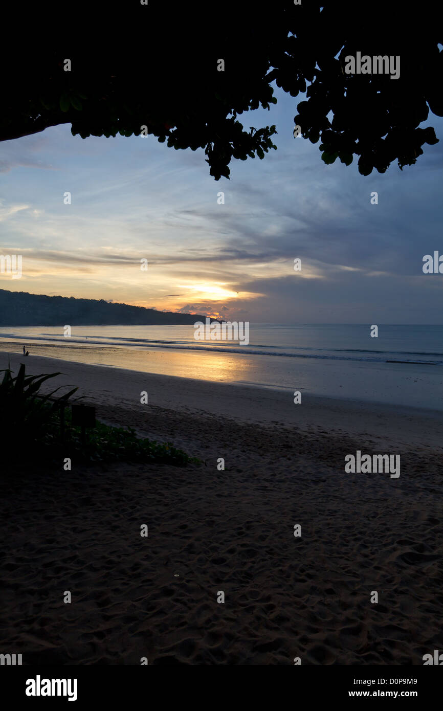 Sunset on the Beach of Jimbaran on Bali, Indonesia Stock Photo - Alamy