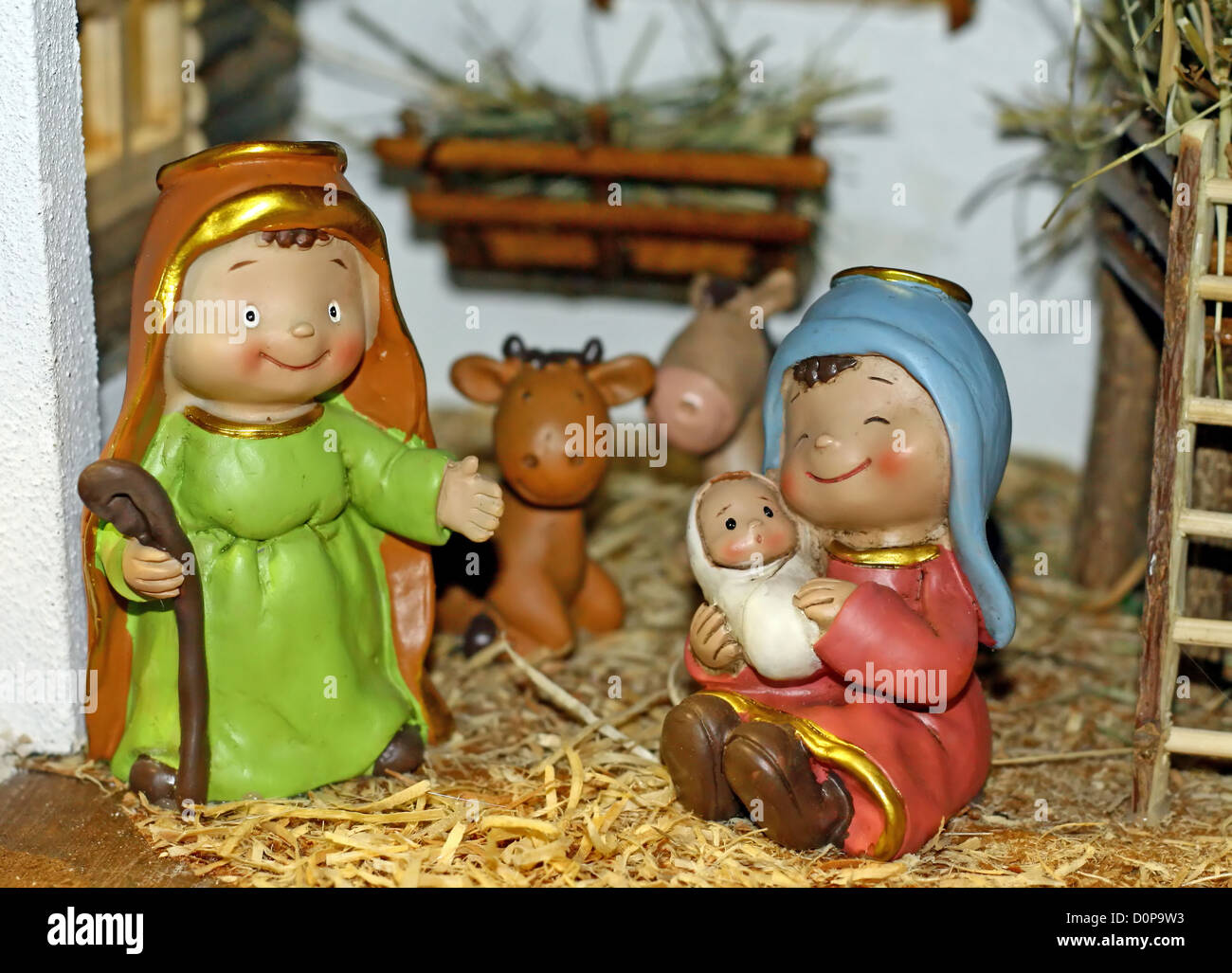 statues of smiling a Nativity scene with Holy Family in the Manger ...