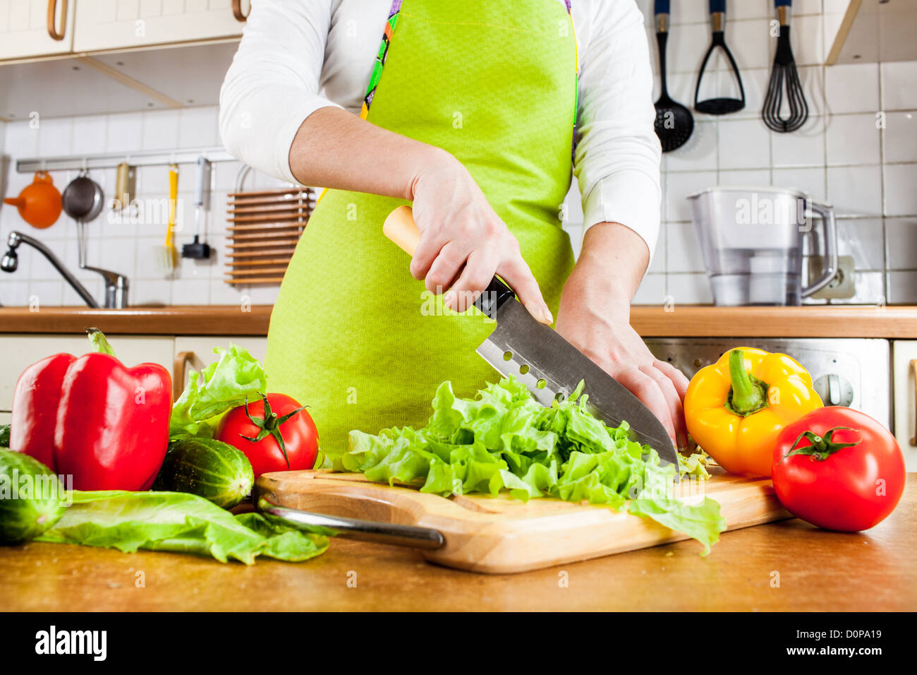 Woman's hands cutting vegetables Stock Photo - Alamy