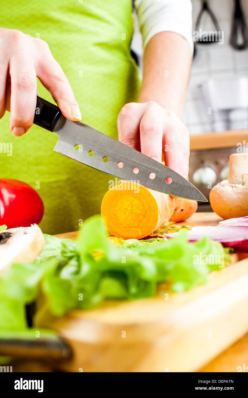 Woman's hands cutting vegetables Stock Photo - Alamy