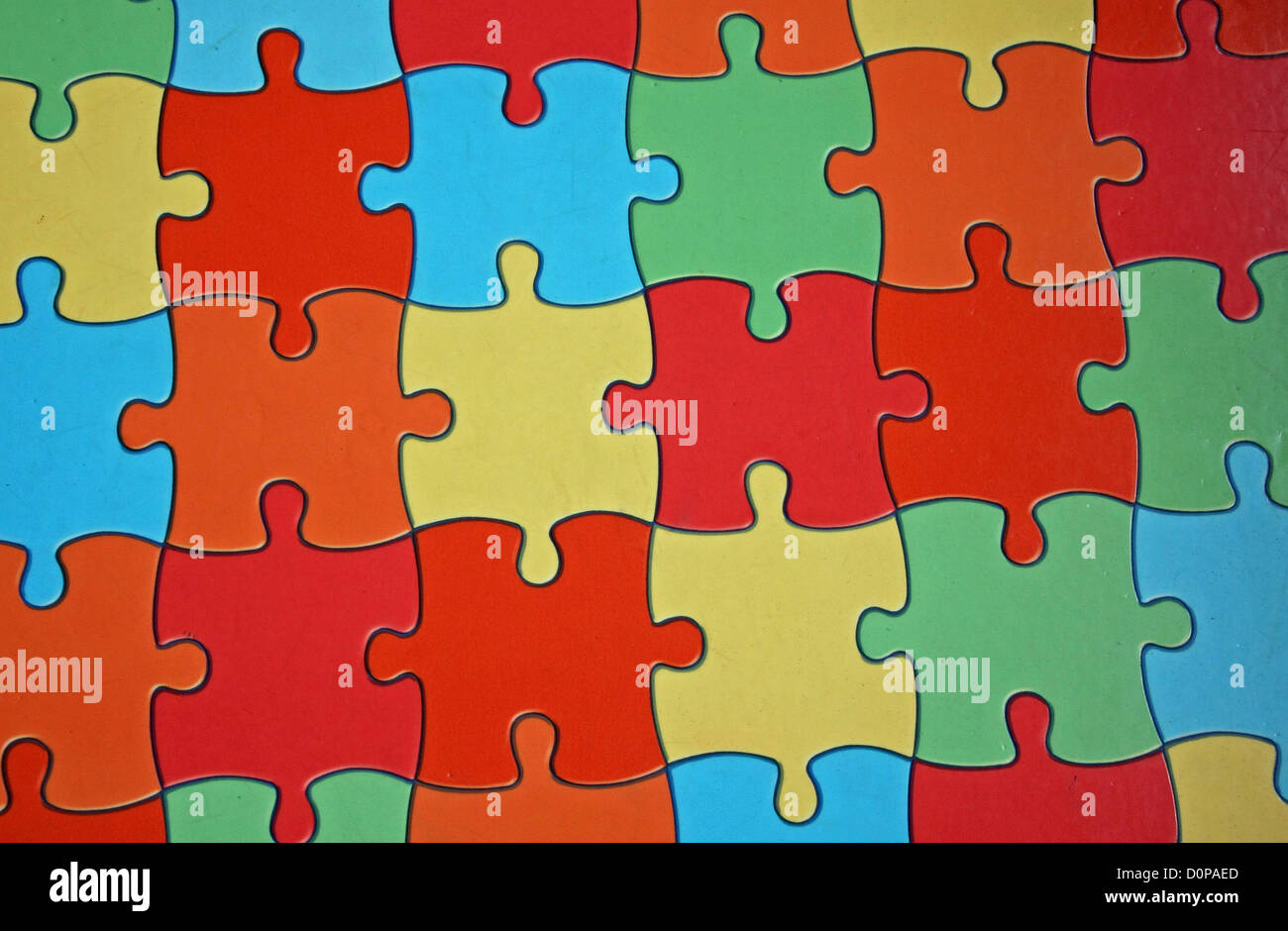 colored puzzle pieces of a complicated game Stock Photo - Alamy