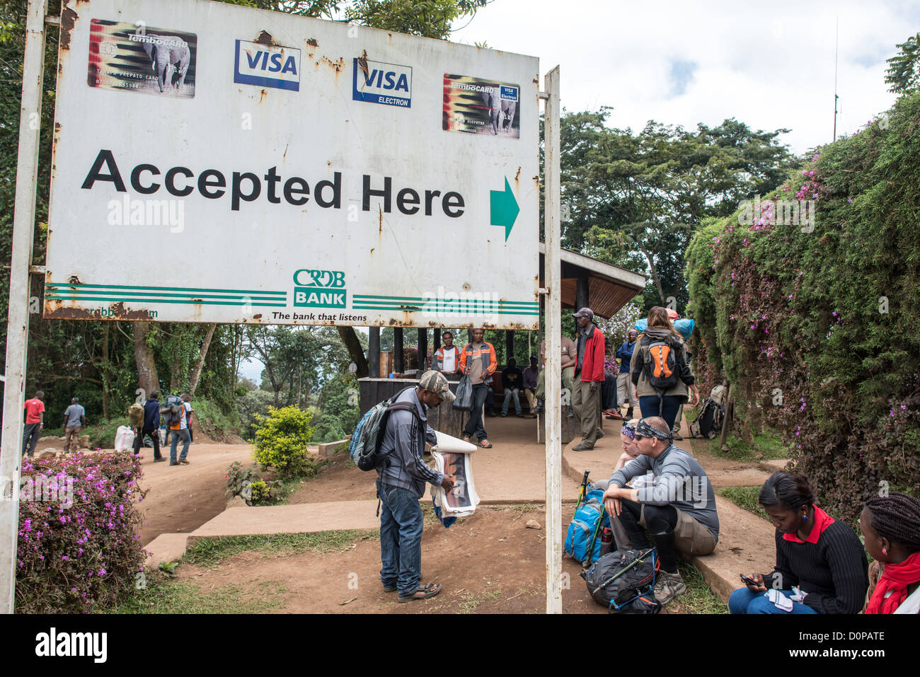 MOUNT KILIMANJARO, Tanzania — Exhausted climbers and souvenir vendors ...
