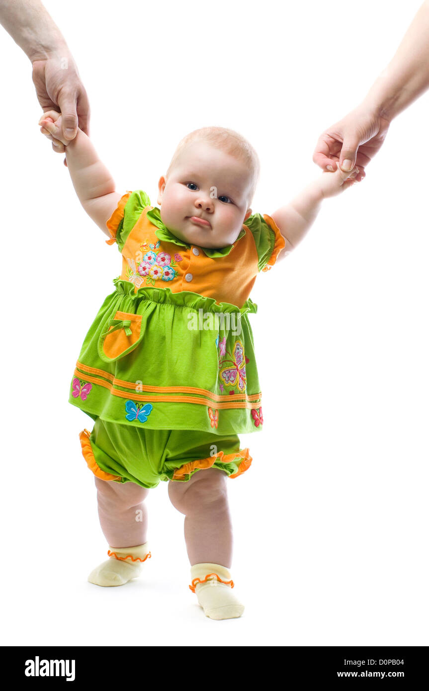 a funny baby is trying tu walk Stock Photo - Alamy