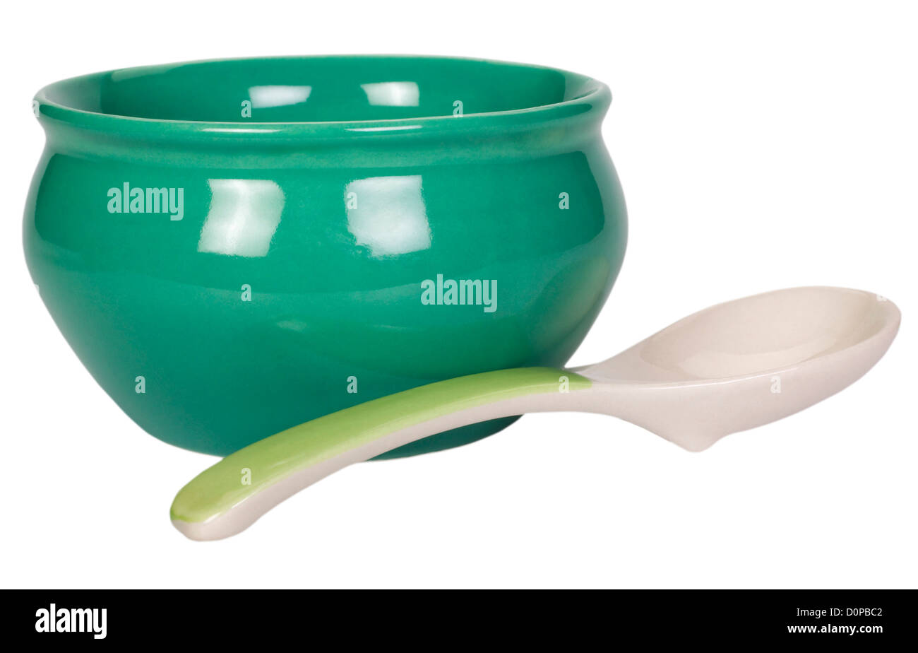 Close-up of a ceramic bowl with a spoon Stock Photo - Alamy
