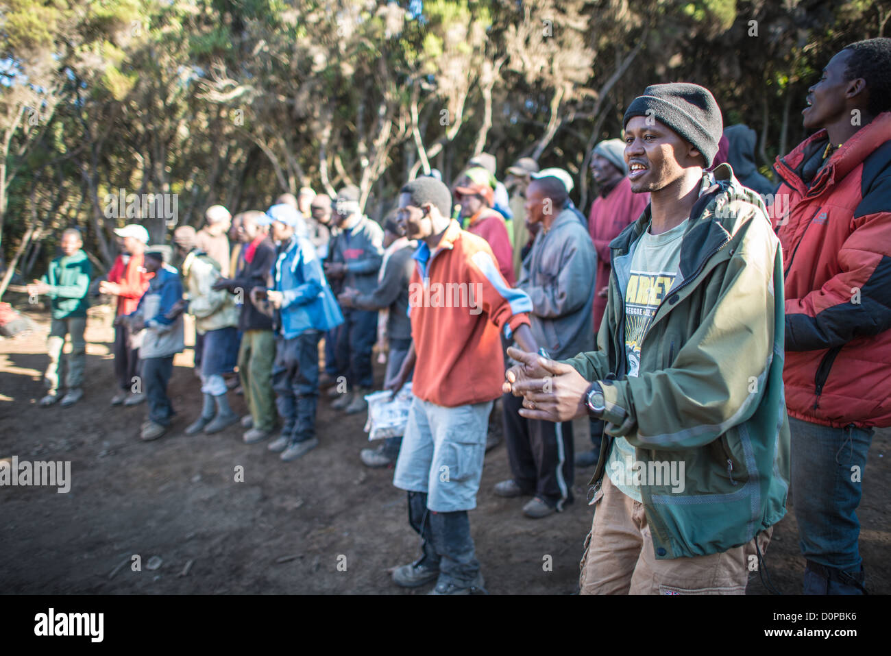 MOUNT KILIMANJARO, Tanzania — Porters perform a song and dance as a ...